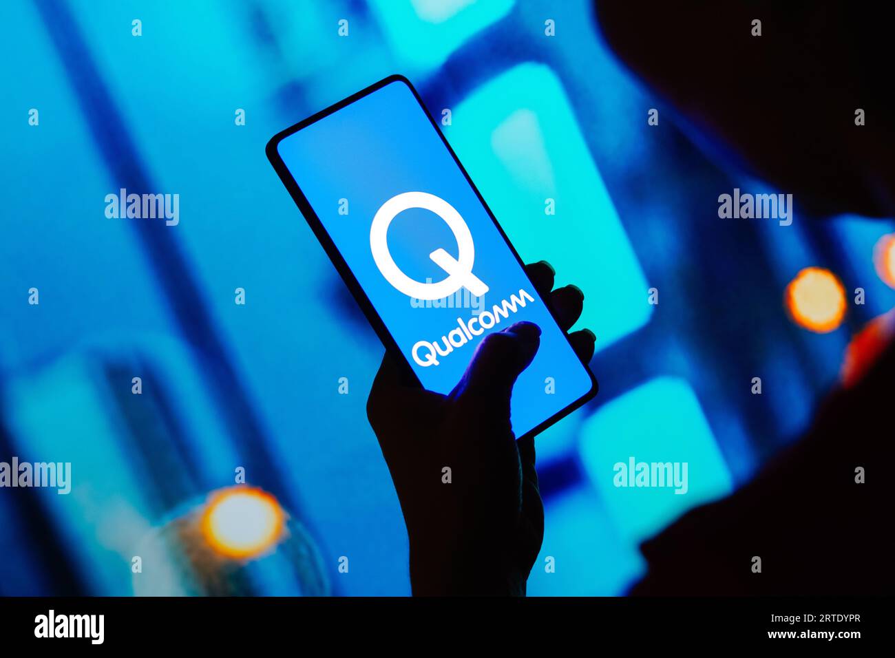 In this photo illustration, the Qualcomm logo is displayed on a ...