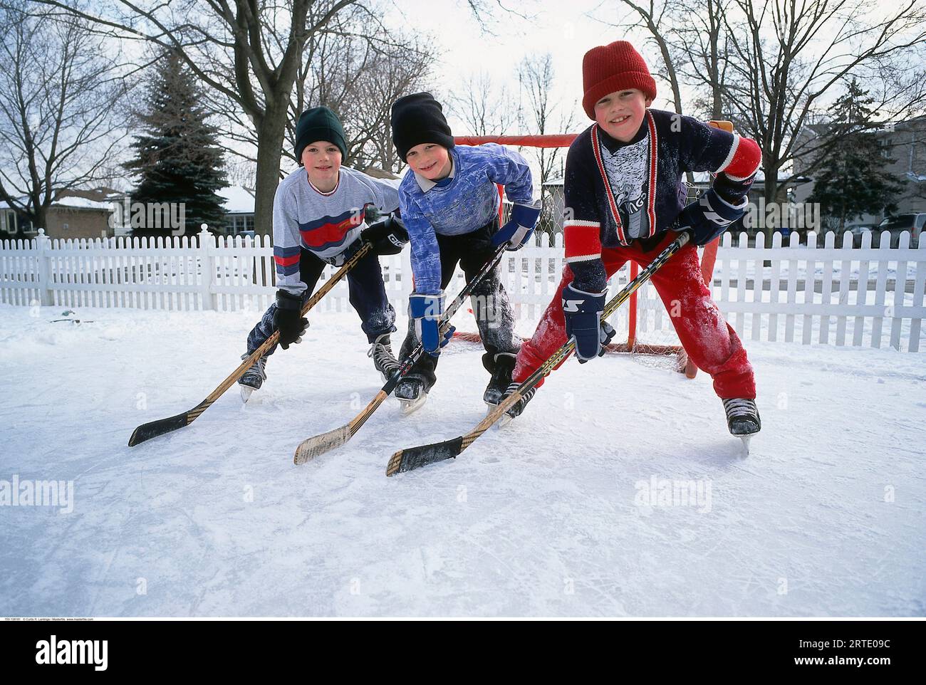 Kids Playing Ice Hockey Outdoors Stock Photo - Alamy