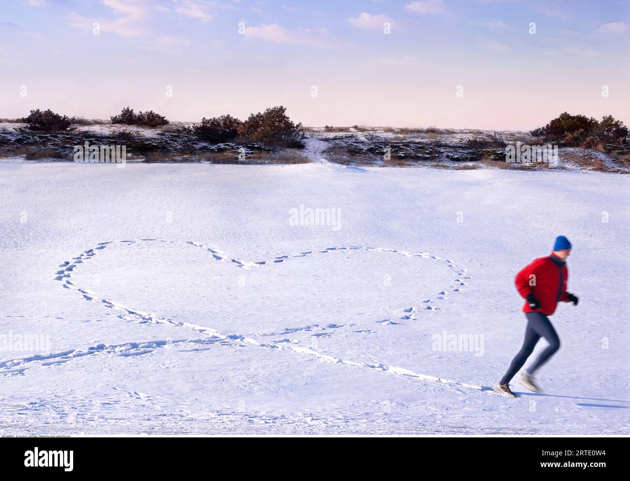 Jogging Man Making Heart Shape with Footprints Stock Photo - Alamy