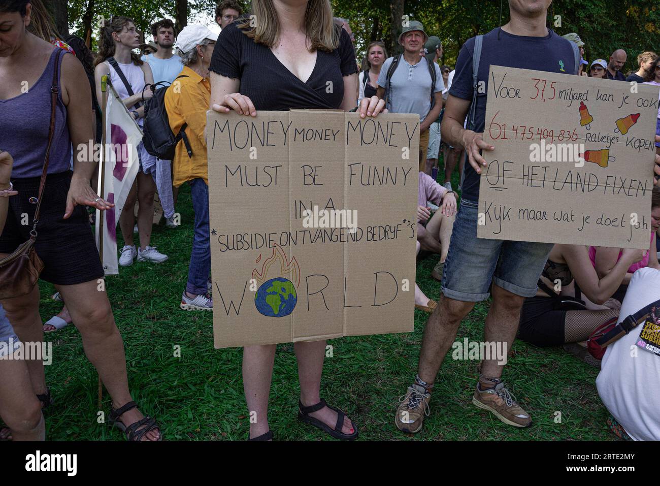 Climate activists hold placards expressing their opinion during the non ...