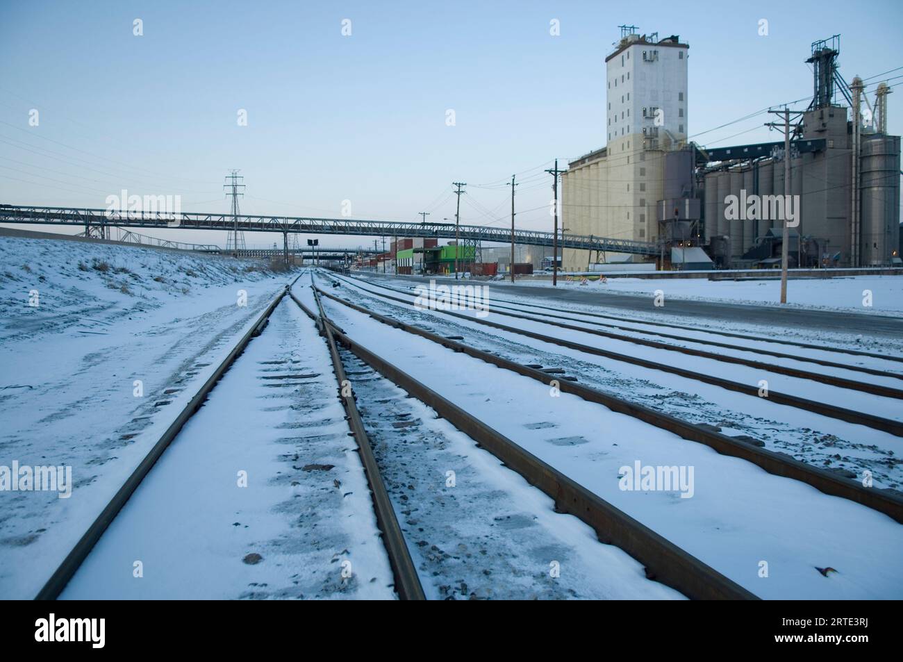 Railroad track covered in snow in St. Louis, Missouri at dusk; St ...