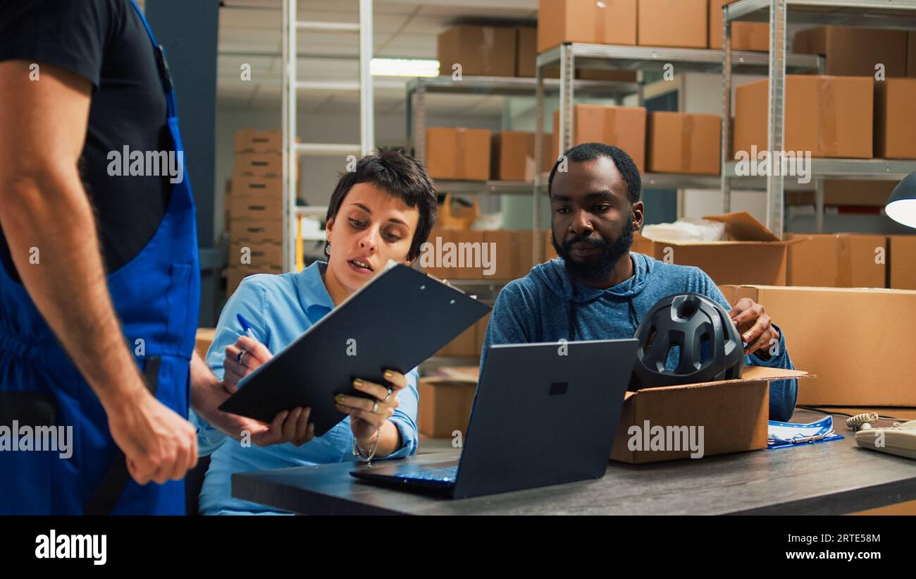 Team startup owners packing merchandise hi-res stock photography and ...