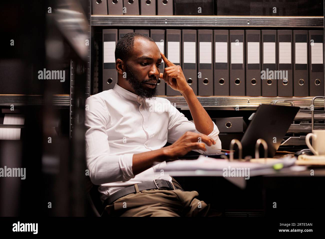 African american detective solving complex crime case using laptop. Law ...