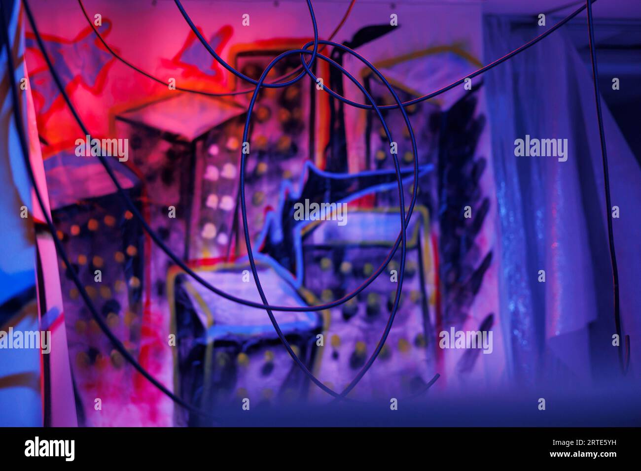 Damaged old place with fluorescent neon lights and dust on walls with ...