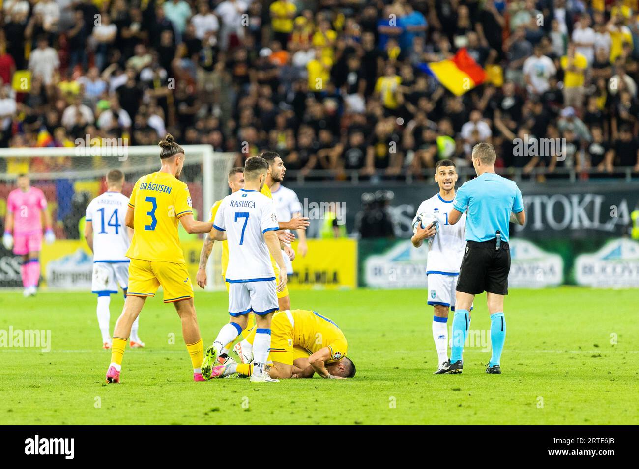Nicolae Stanciu of Romania suffering from a tackle during the UEFA Euro ... Nicolae Stanciu of Romania suffering from a tackle during the UEFA Euro ...