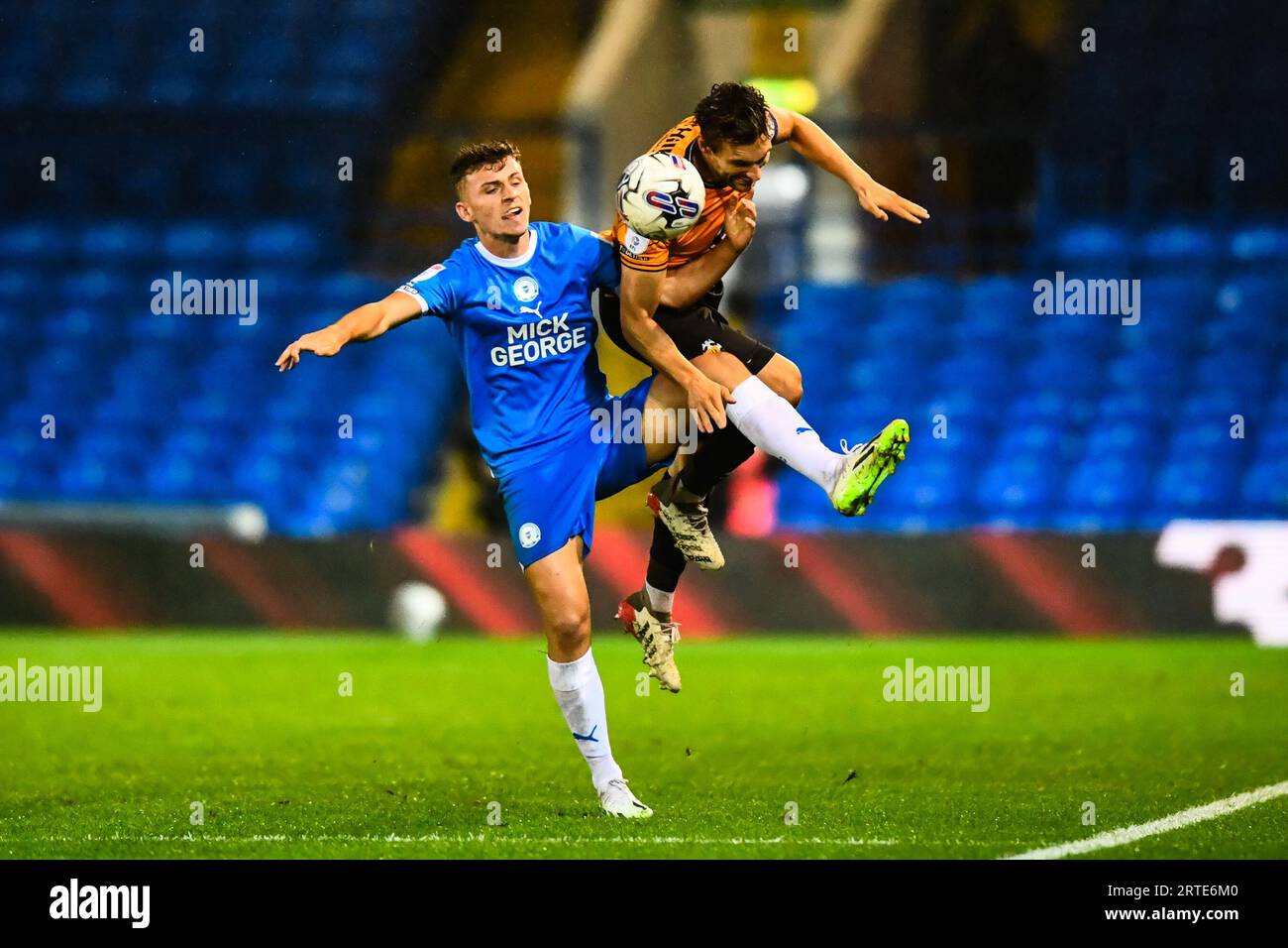 Harrison Burrows (3 Peterborough United) challenged by Harrison Dunk ...