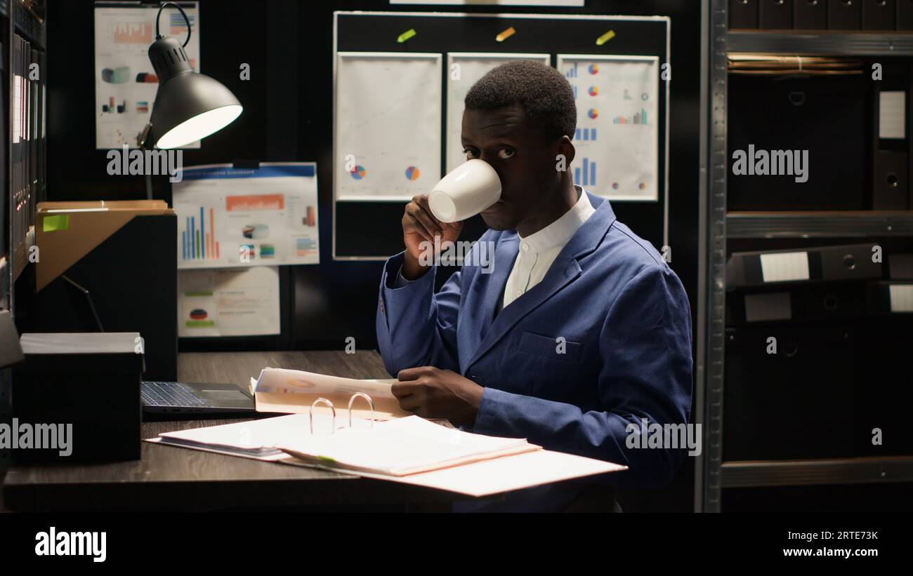 African american policeman looking laptop hi-res stock photography and ...