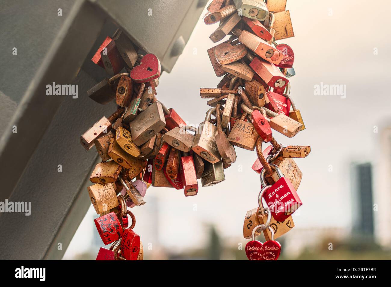 Love locks and labeled padlocks from loving people on a bridge to ...