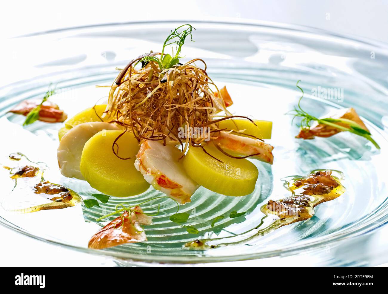 Lobster with saffron potatoes and truffle shavings Stock Photo - Alamy