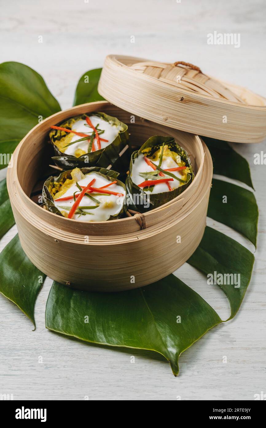 Amok (Steamed fish in banana leaf with creamy curry sauce and coconut ...