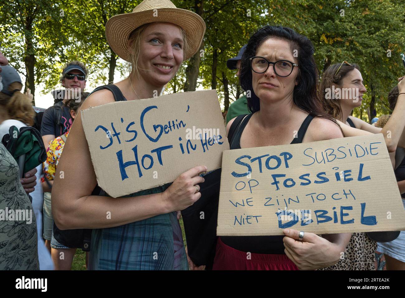 Climate activists hold placards expressing their opinion during the non ...