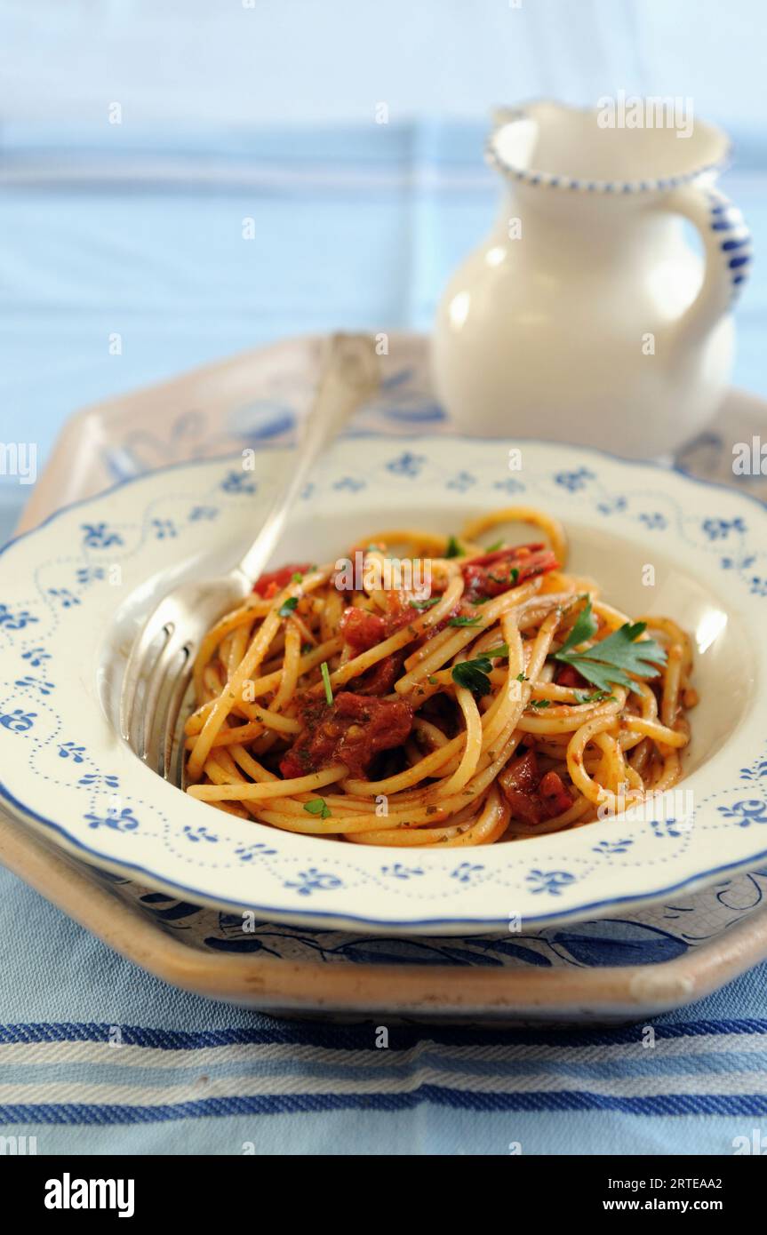 Spaghetti with sun-dried tomatoes and chilli Stock Photo - Alamy