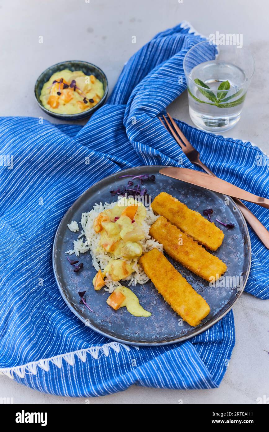Fish fingers rice sauce hi-res stock photography and images - Alamy