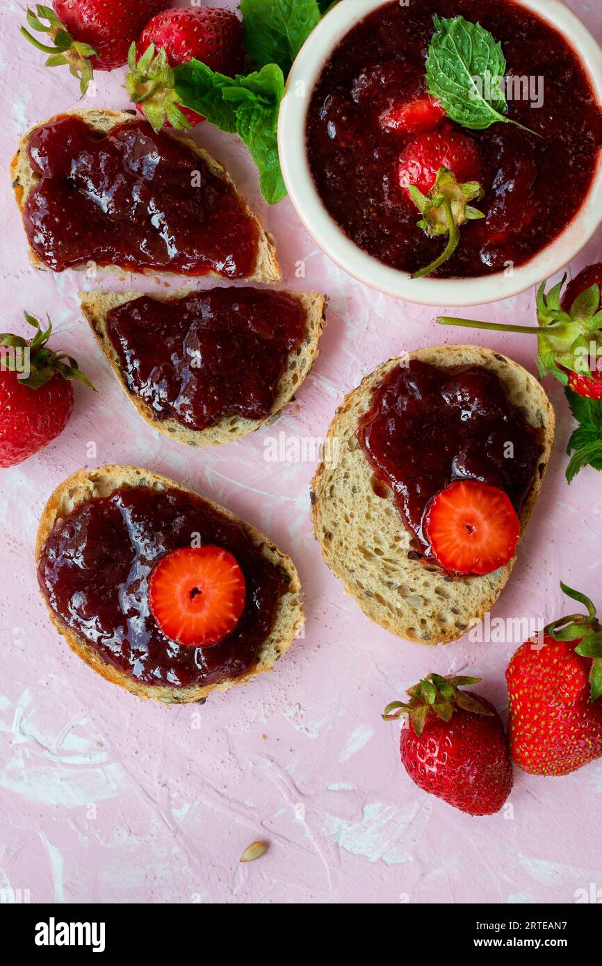 Strawberry jam on bread Stock Photo - Alamy