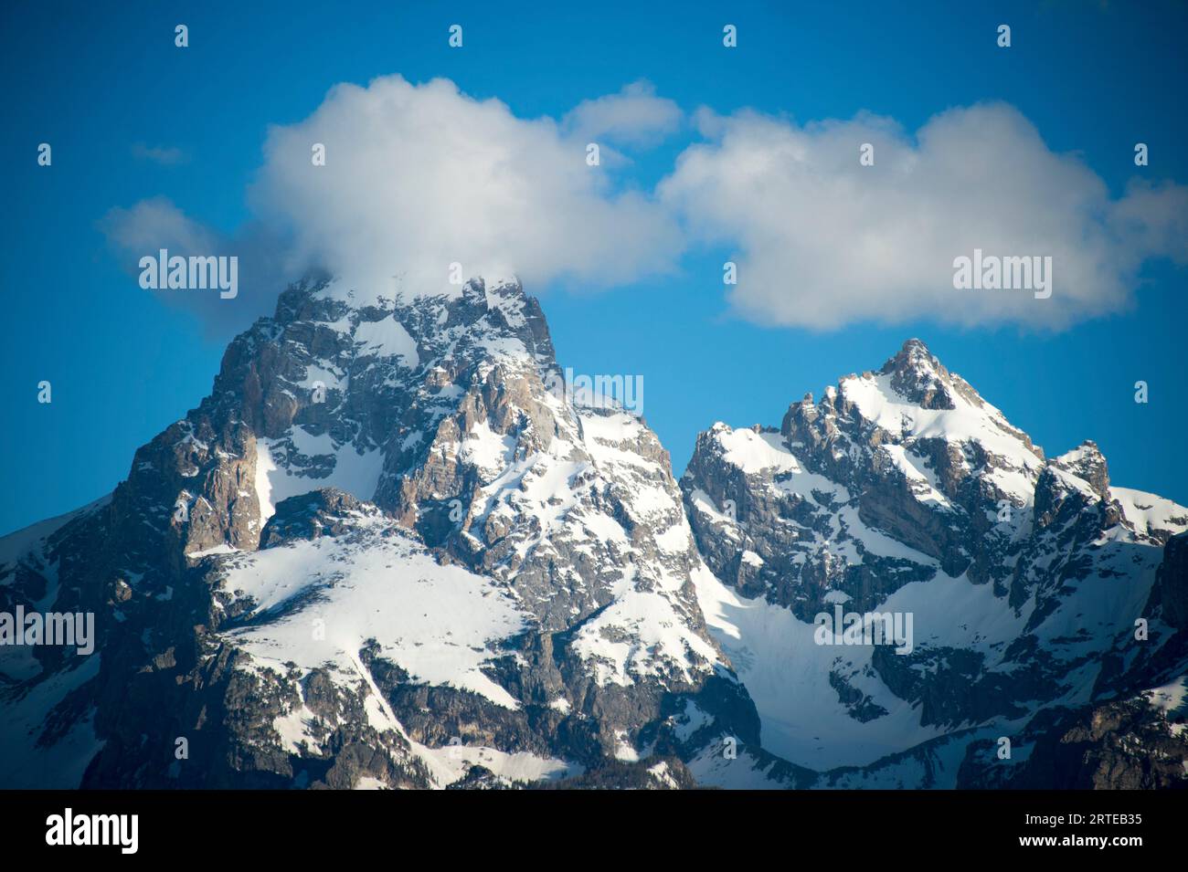 Clouds along a peak of the Grand Tetons in Grand Teton National Park ...