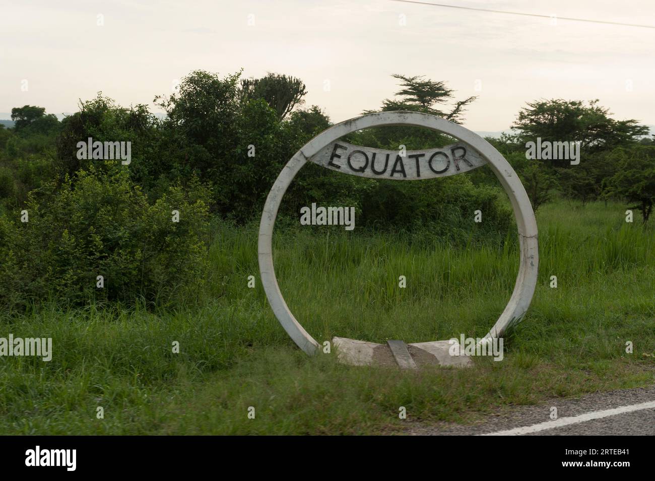 Sign marks the equatorial line along the road near Queen Elizabeth ...