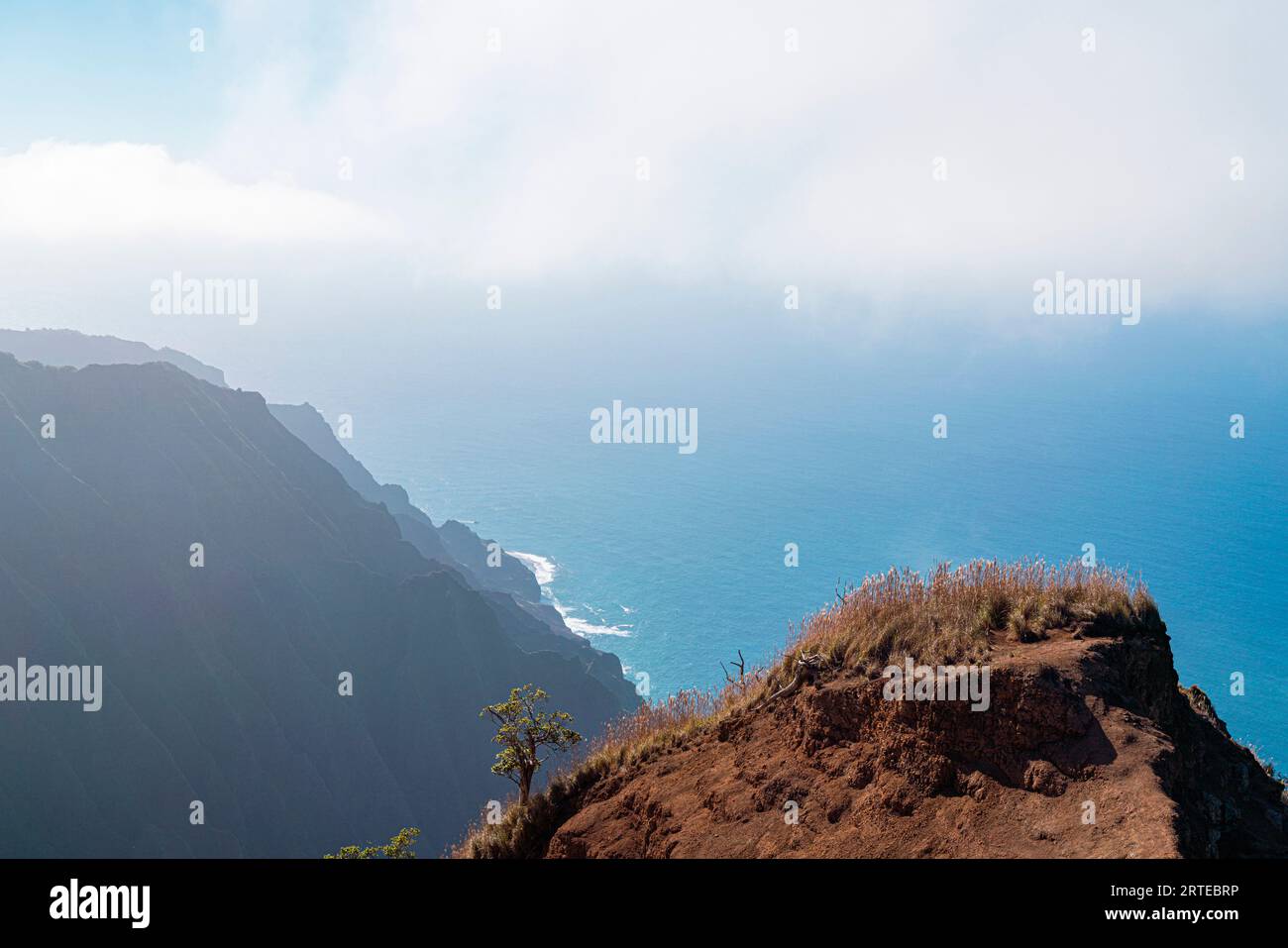 Clifftop outlook with scenic view of the mountain cliffs of the Napali ...