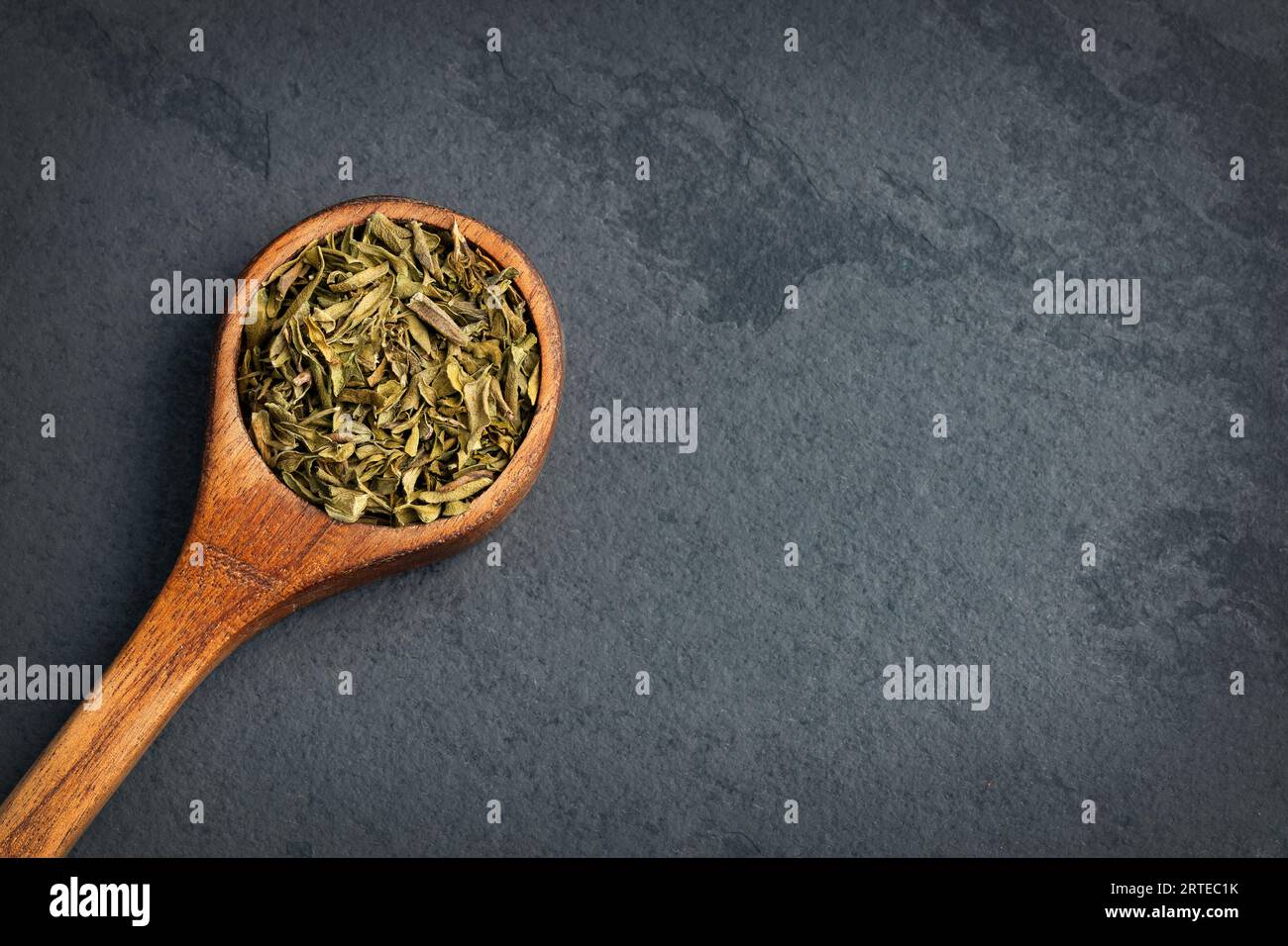 Dried rue leaves in the spoon - Ruta graveolens Stock Photo - Alamy