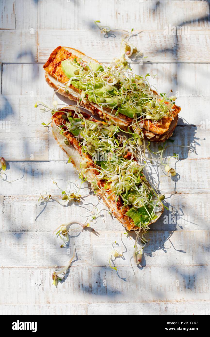 Pretzel stick with soya schnitzel and sprouts Stock Photo - Alamy