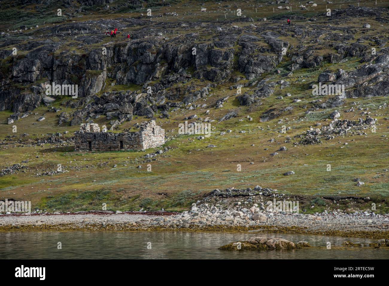Tour group exploring the archaeological site of Hvalsey, near Qaqortoq ...
