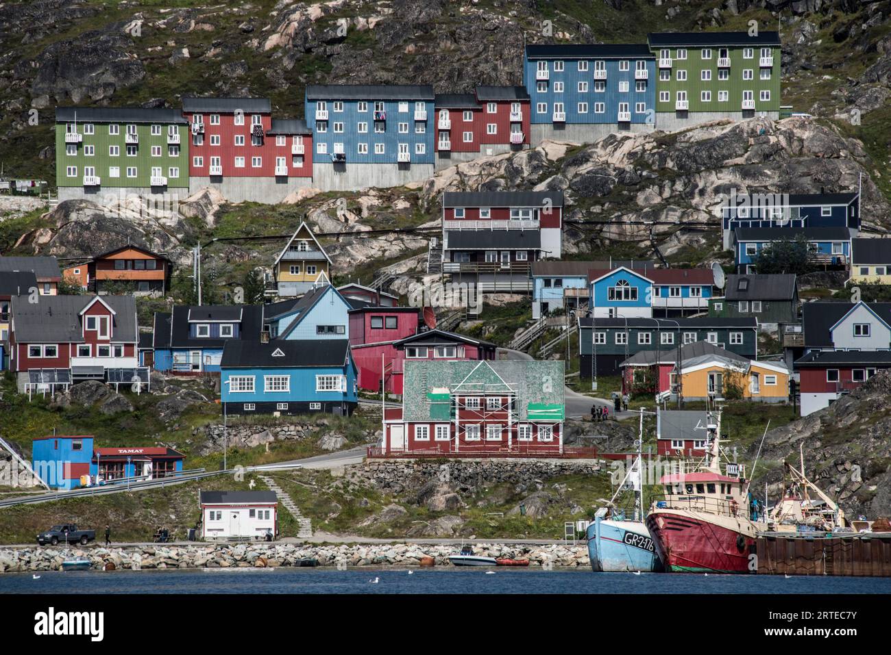 Close-up view of the colorful buildings on the rocky cliffs along the ...
