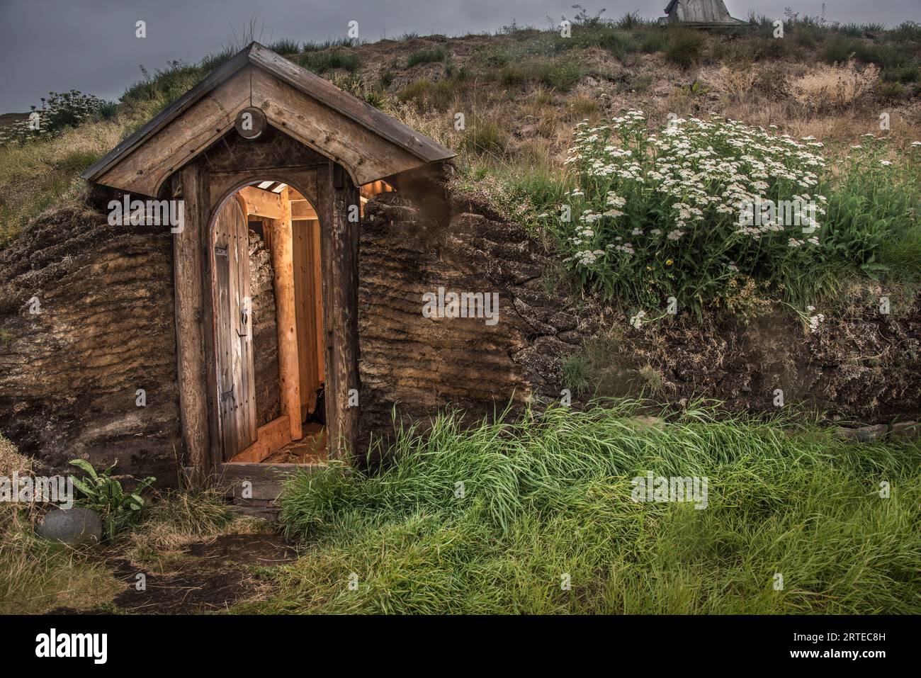Stone and turf structure with wooden doorway at the recreated longhouse ...
