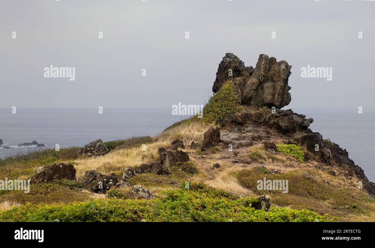 Volcanic rock formations along the cliffs of the Pacific Ocean on a ...