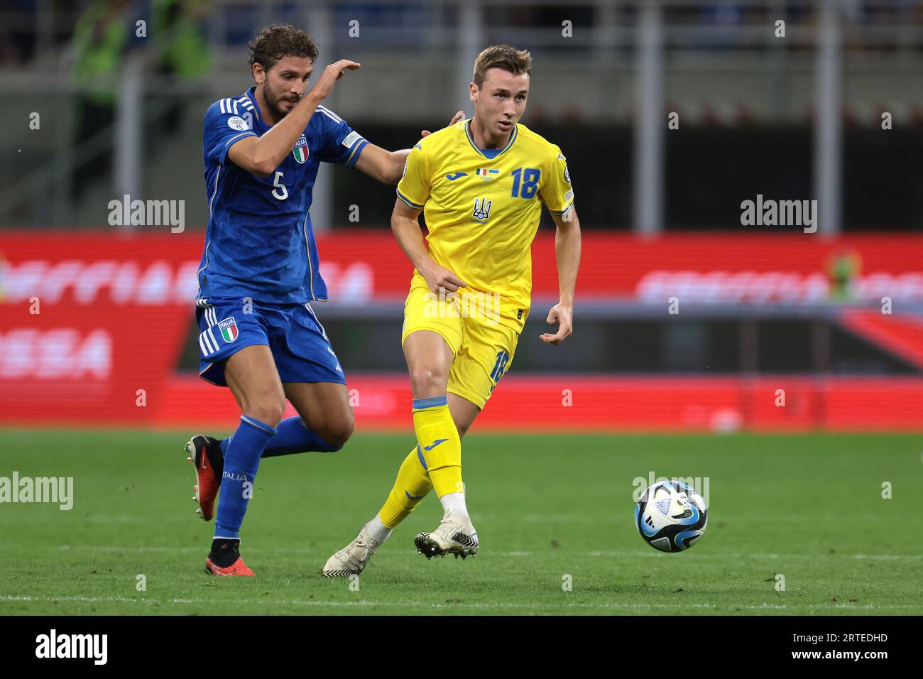 Milan, Italy. 12th Sep, 2023. Manuel Locatelli of Italy tussles with ...