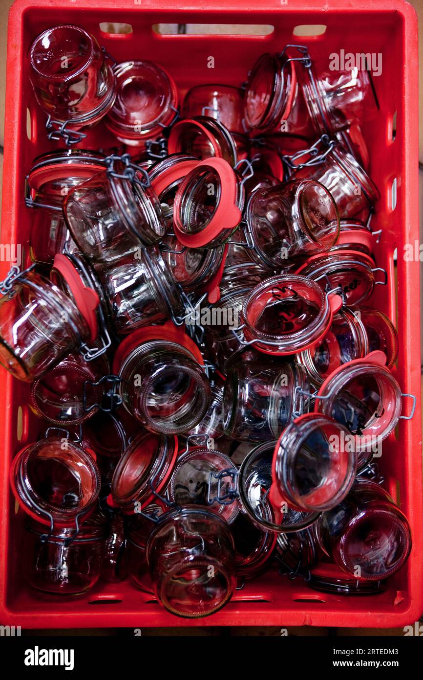Many preserving jars in a red box Stock Photo - Alamy