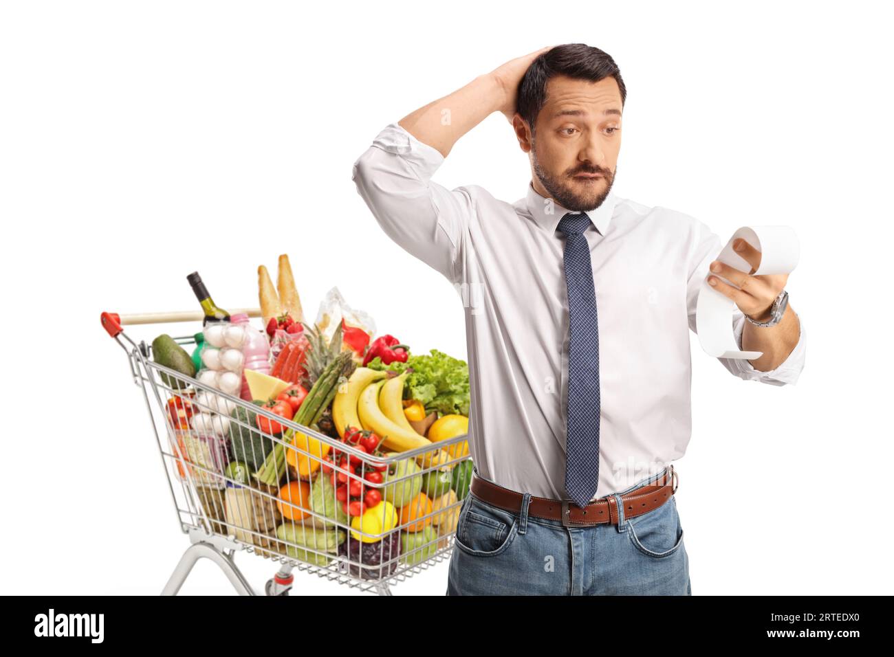 Shocked man with a bill in front of a shopping cart holding his head in ...