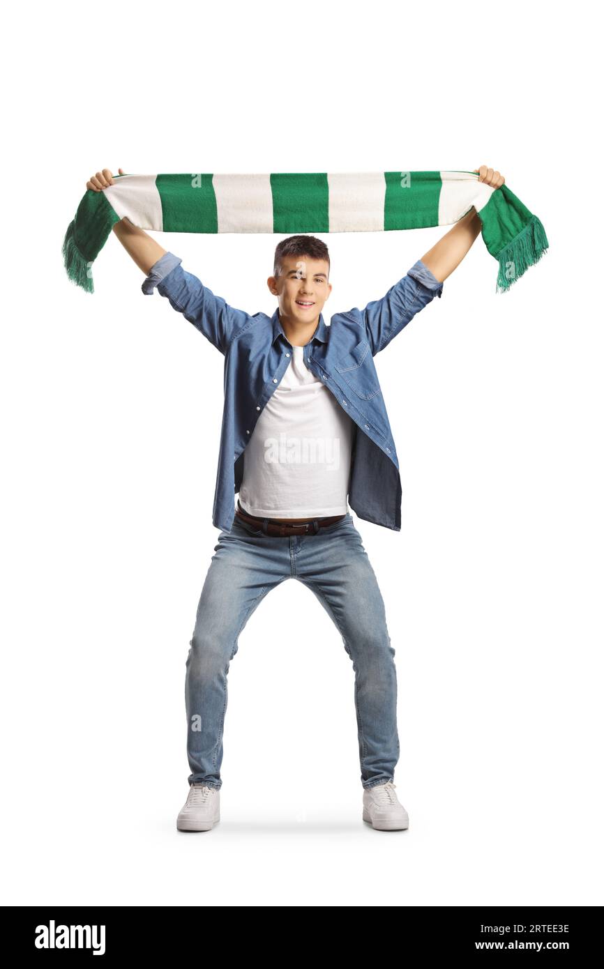 Happy young man cheering with a scarf isolated on white background ...