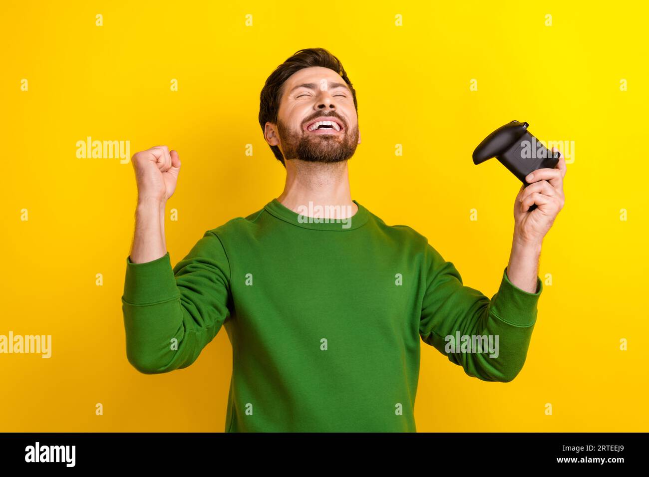 Photo of crazy winner champion best world player young guy fist hold ...