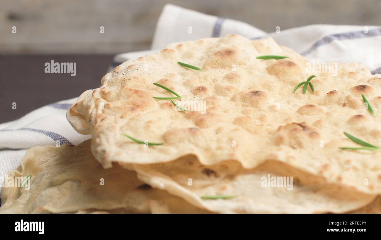 Homemade hot chapati on kitchen countertop background. Zooming slide ...