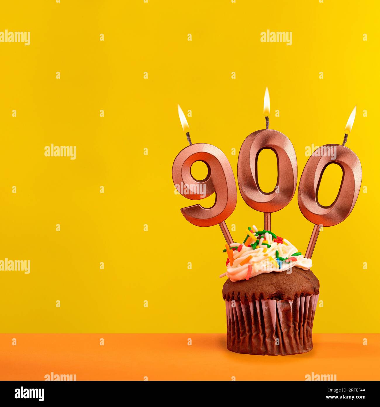 Number 900 anniversary candle - Celebration on yellow background Stock ...