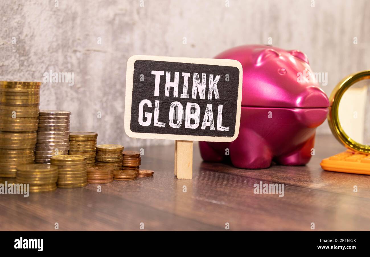 Think Global Concept, Think Global text on card Stock Photo - Alamy