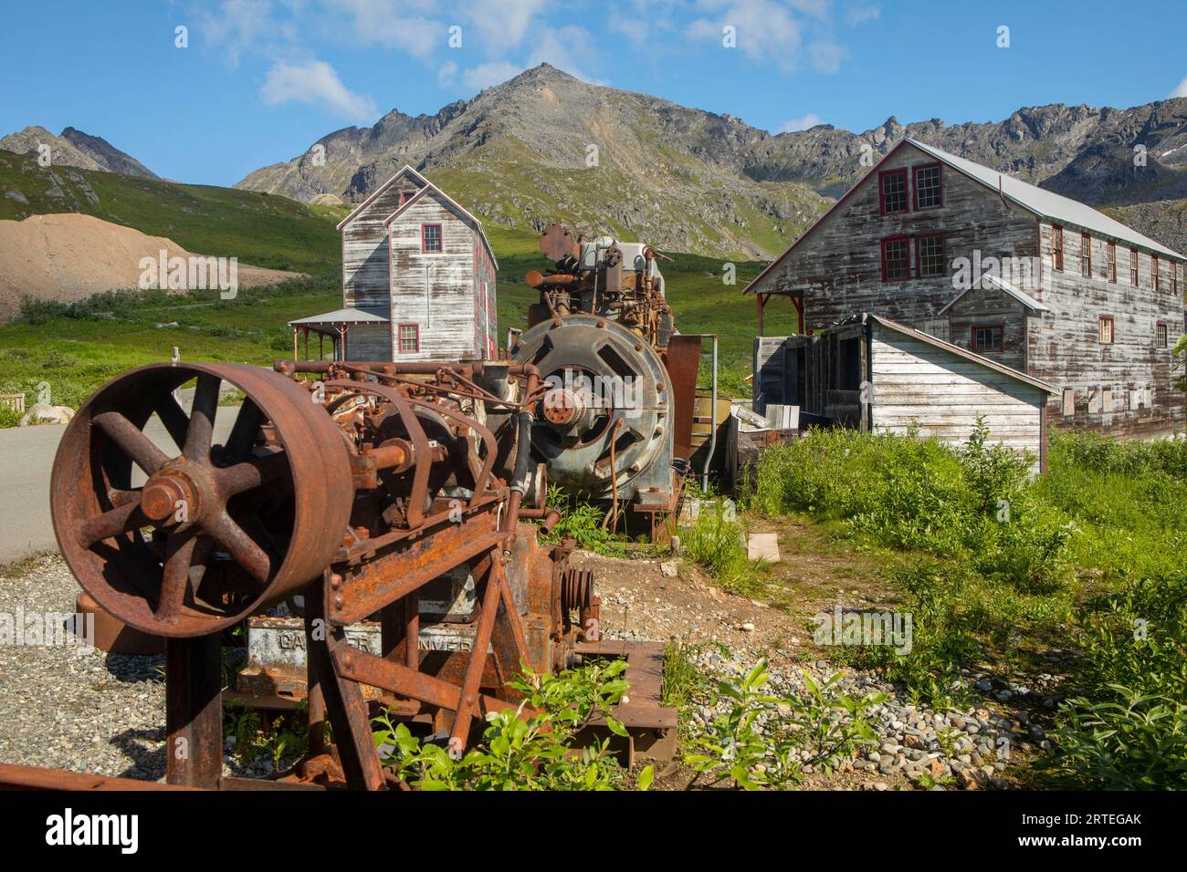 Old mining buildings, with walking trail through them, and old rusty ...