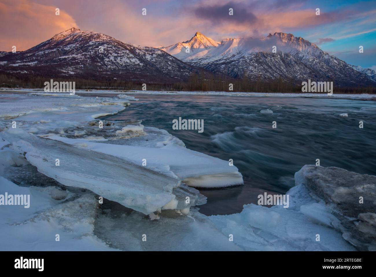 Lazy Mountain and Pioneer Peak lit up with alpenglow on winter night at ...