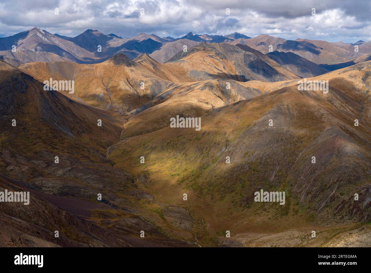 Aerial view of mountains and tundra in autumn colours in Tombstone ...