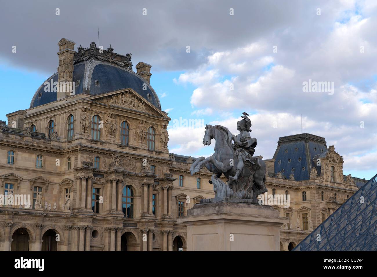 Statue and buildings at the Louvre Museum in Paris; Paris, France Stock ...