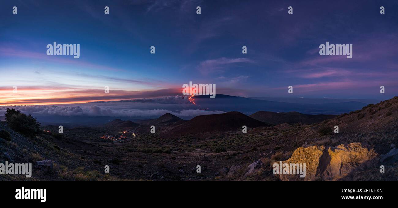 Stunning view from the rocky mountaintop of Mauna Kea of the 2022 eruption and lava flow of ...