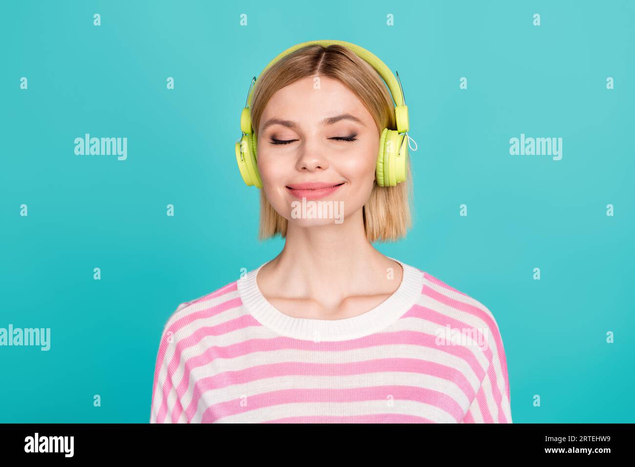 Portrait of young girlfriend wearing striped pink sweater closed eyes ...