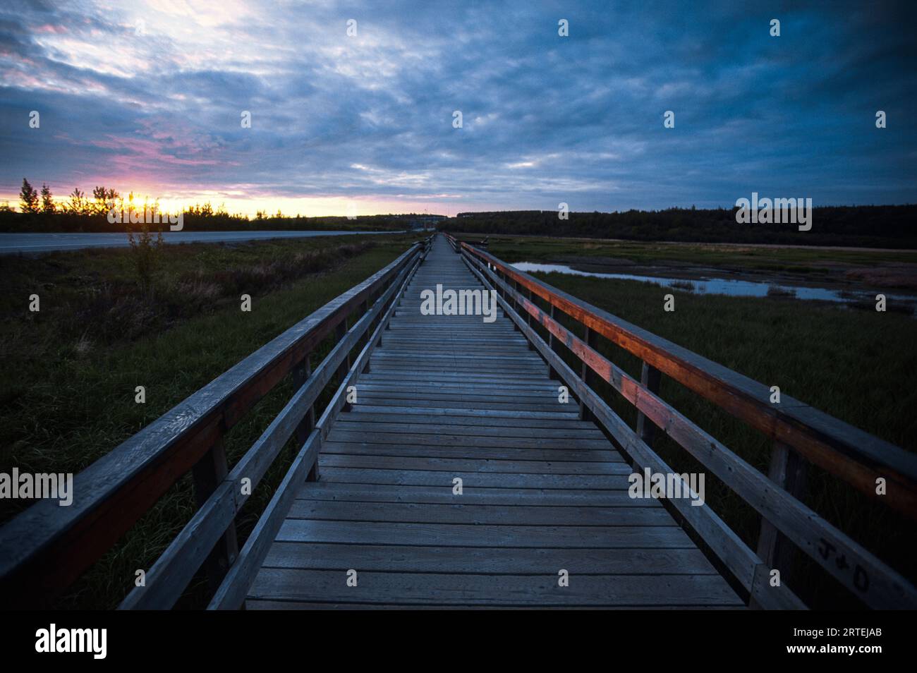 Boardwalk on Potter Marsh at sunset, Alaska, USA; Potter Marsh, Alaska ...
