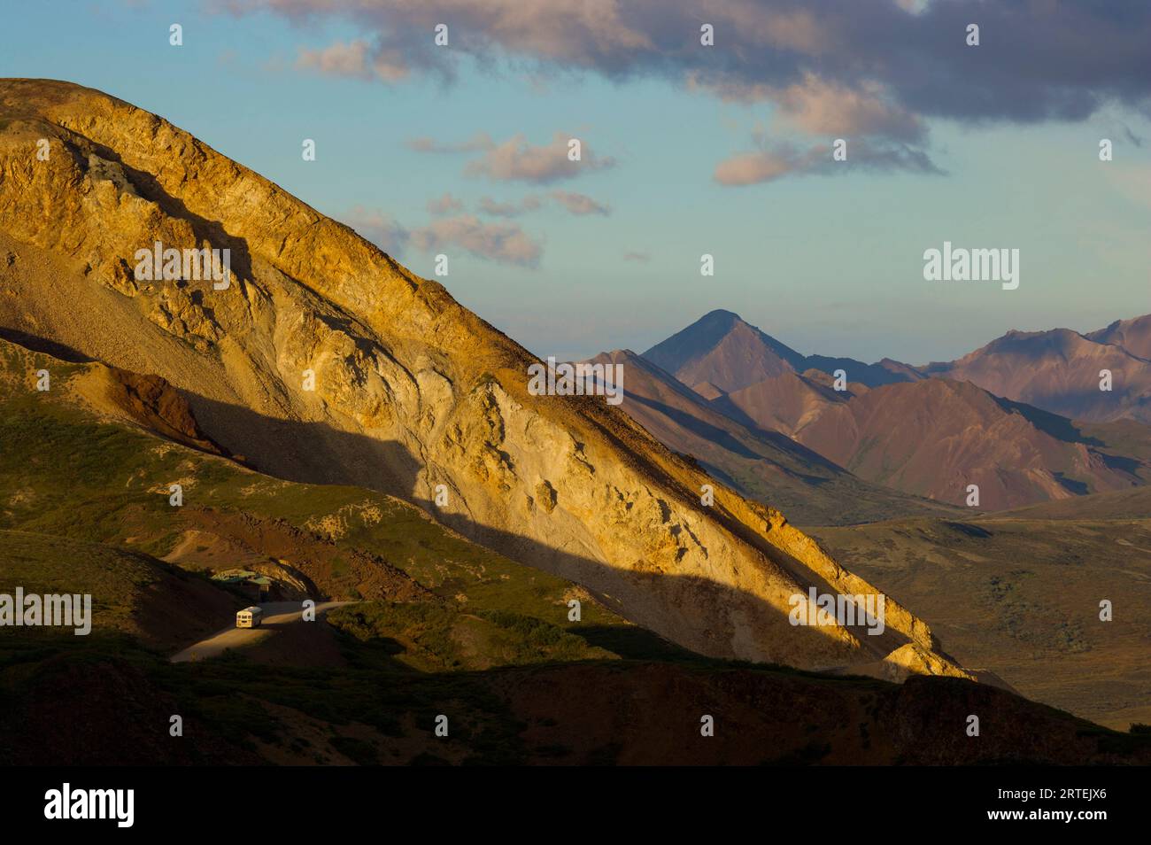 Tour bus moves through Polychrome Pass in Denali National Park and ...