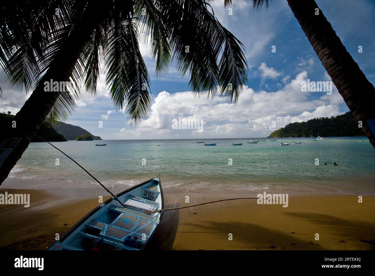 Boat on a sandy beach at Charlotteville, Tobago; Charlotteville, Tobago ...