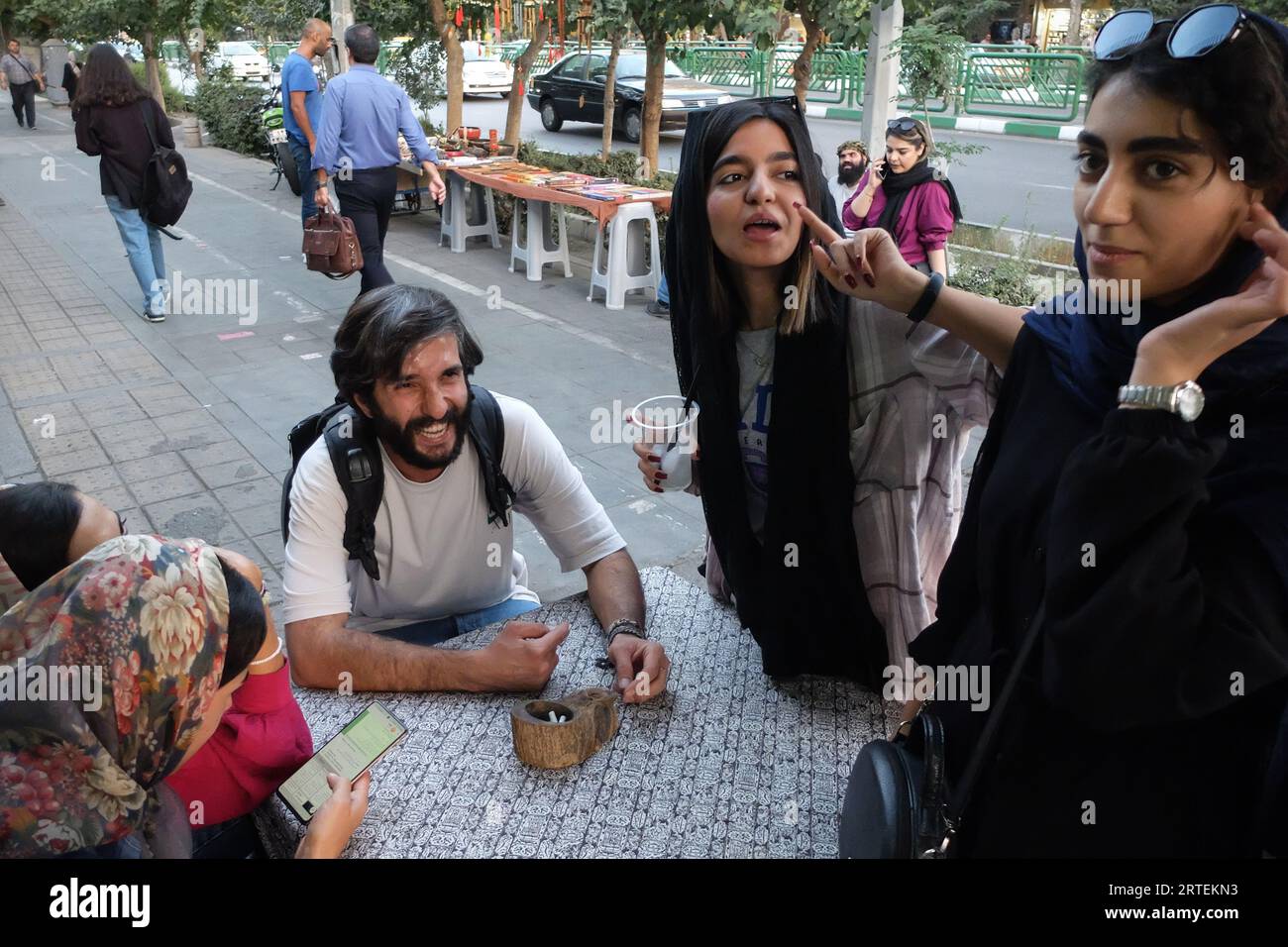 Tehran, Iran. 12th Sep, 2023. Iranian youth gather in front of a small ...