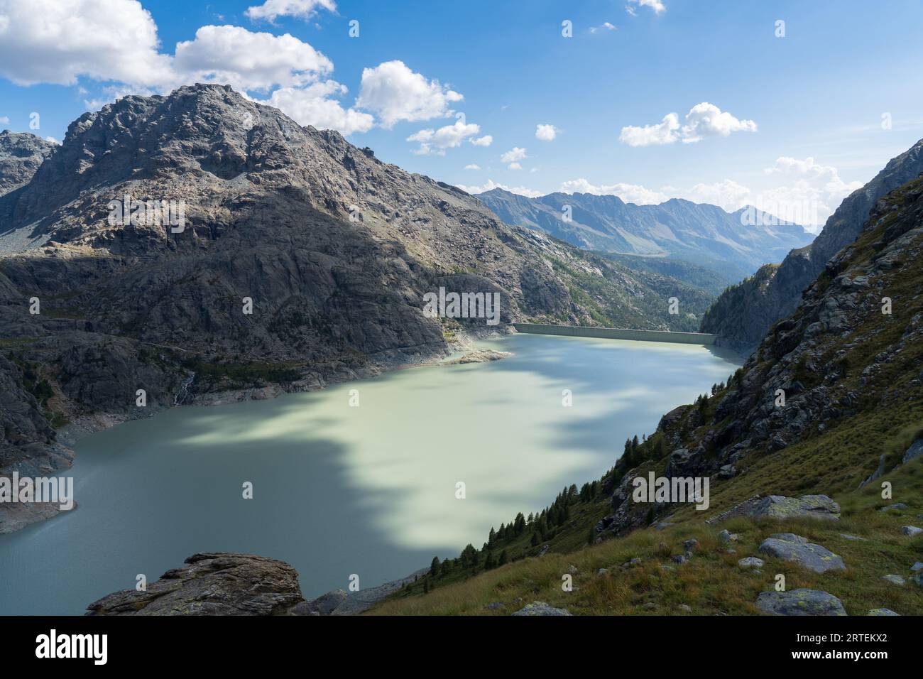 View from Bignami hut of Alpe Gera alpine lake and dam in the mountains ...