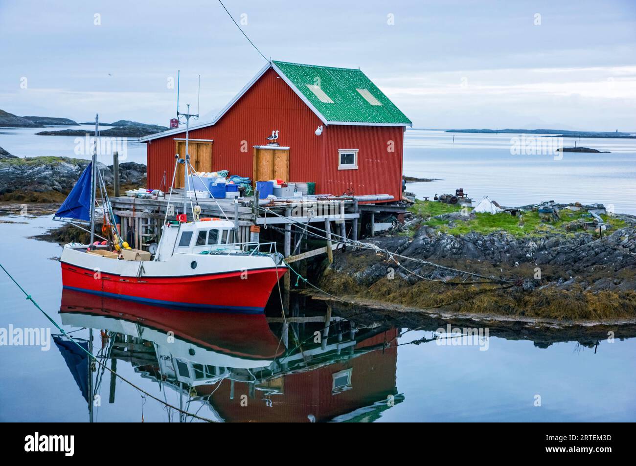 Fishing boat alongside a dock in Lovund; Lovund Island, Norway Stock ...