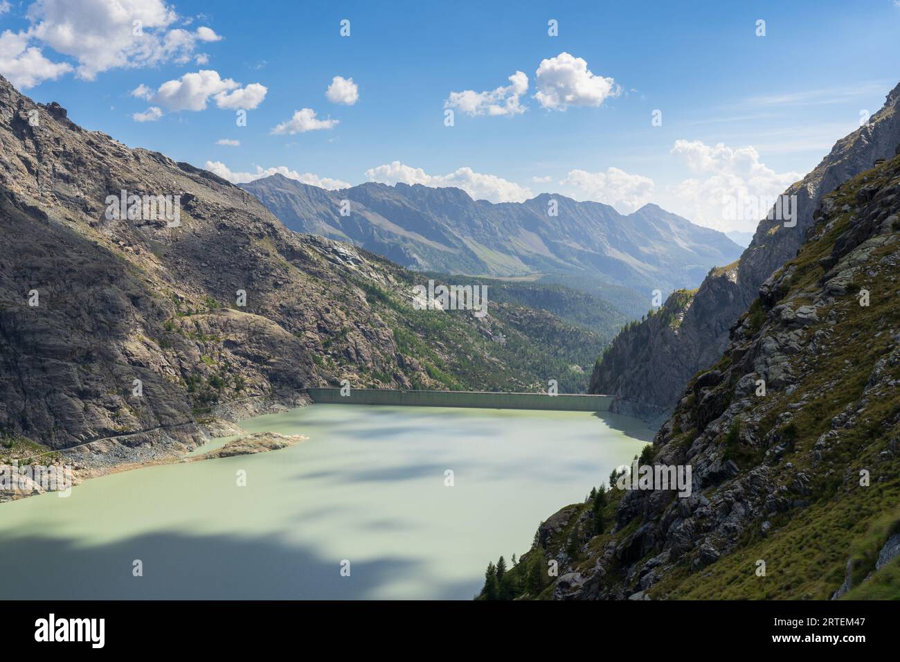 View from Bignami hut of Alpe Gera alpine lake and dam in the mountains ...