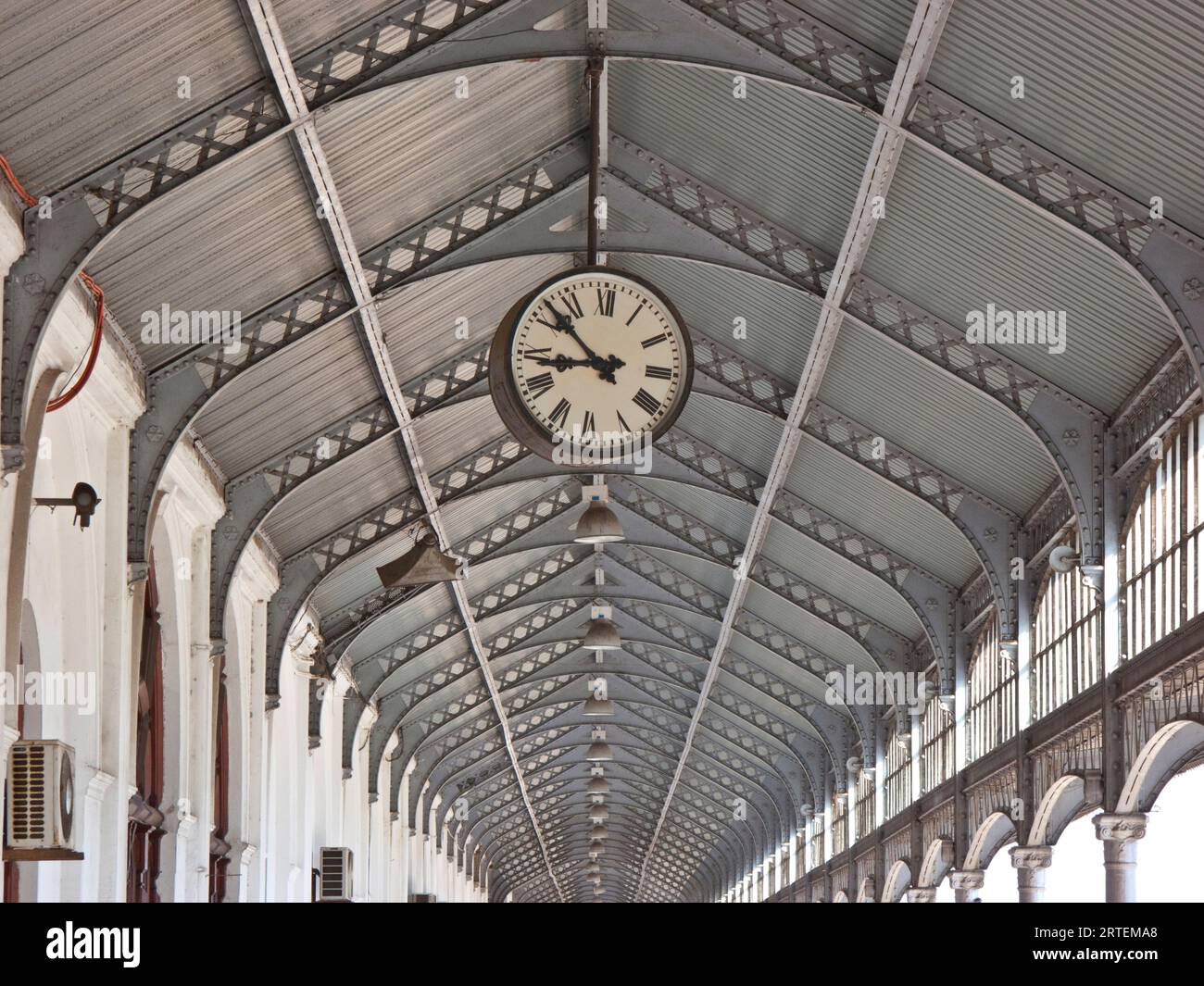 Clock hanging from the rafters of a ceiling; Maputo, Mozambique Stock ...