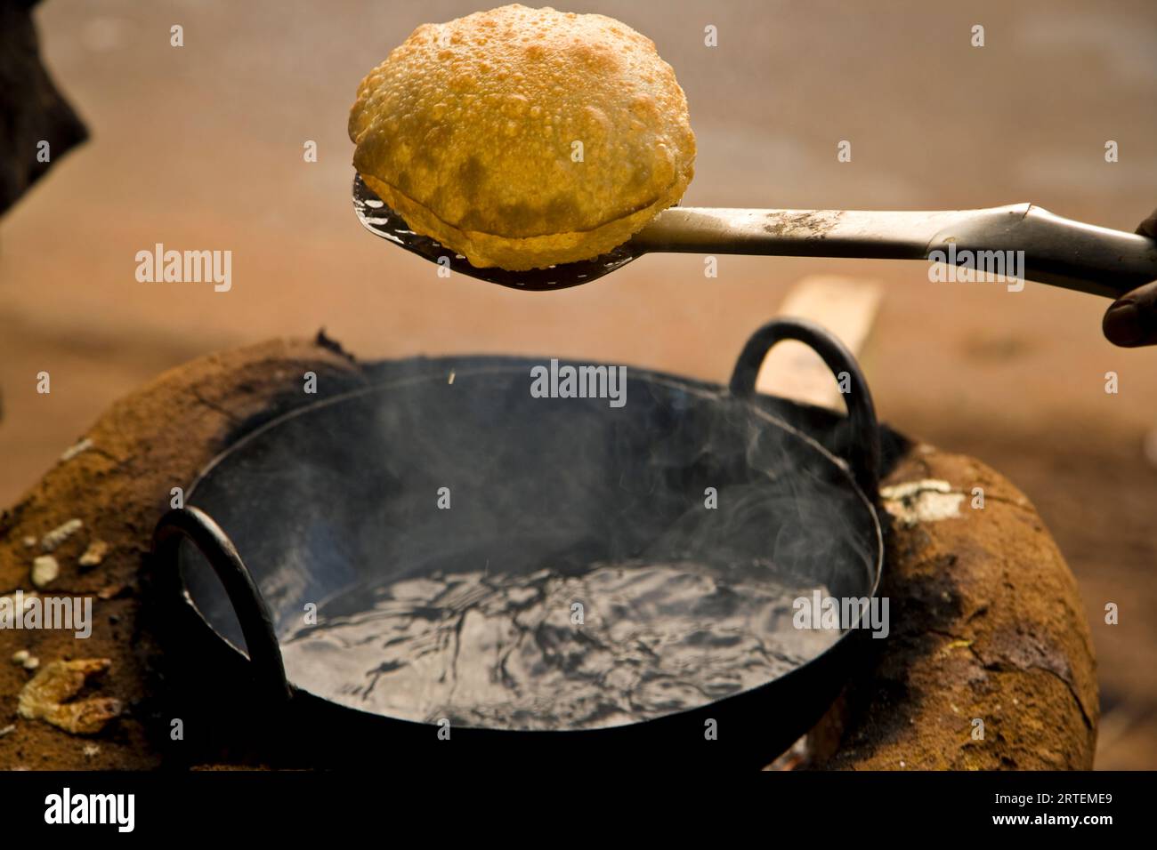 Fresh fried poori, or puri, on the streets of India; Karaikudi ...